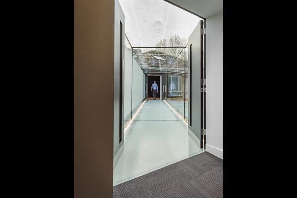 Paul Vick Architects completes 15m-long glass bridge for global ...